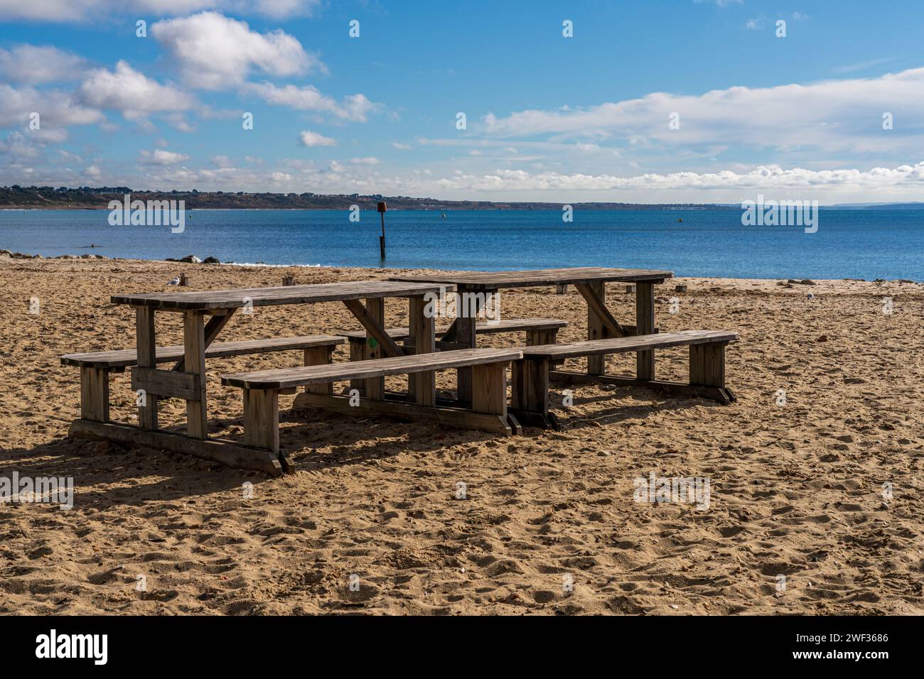 Picnic benches on the beach in Avon Beach, Mudeford, Dorset, England ...