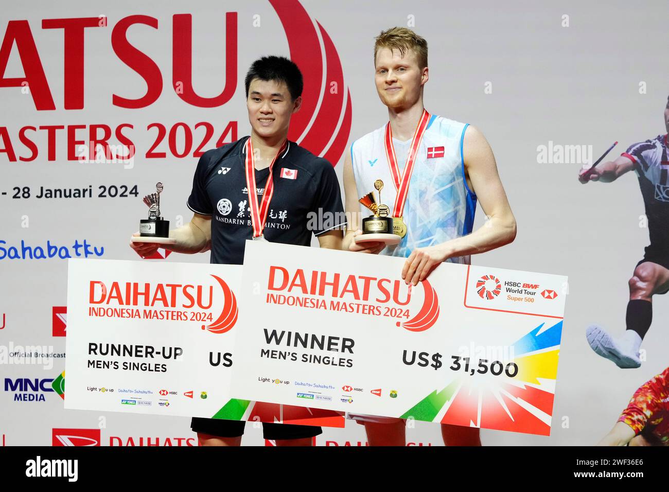 First place winner Denmark's Anders Antonsen, right, celebrates on the ...