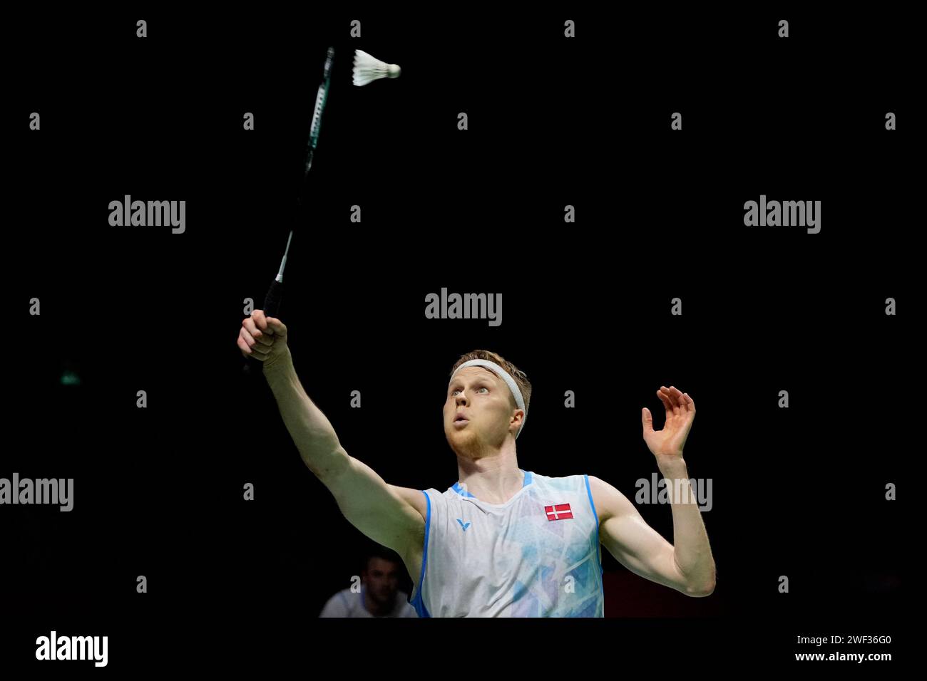Denmark's Anders Antonsen plays a shot against Canada's Brian Yang ...