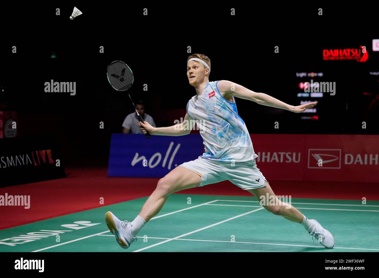 Denmark's Anders Antonsen plays a shot against Canada's Brian Yang ...