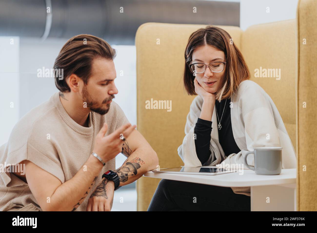 Two positive professionals working together hi-res stock photography ...