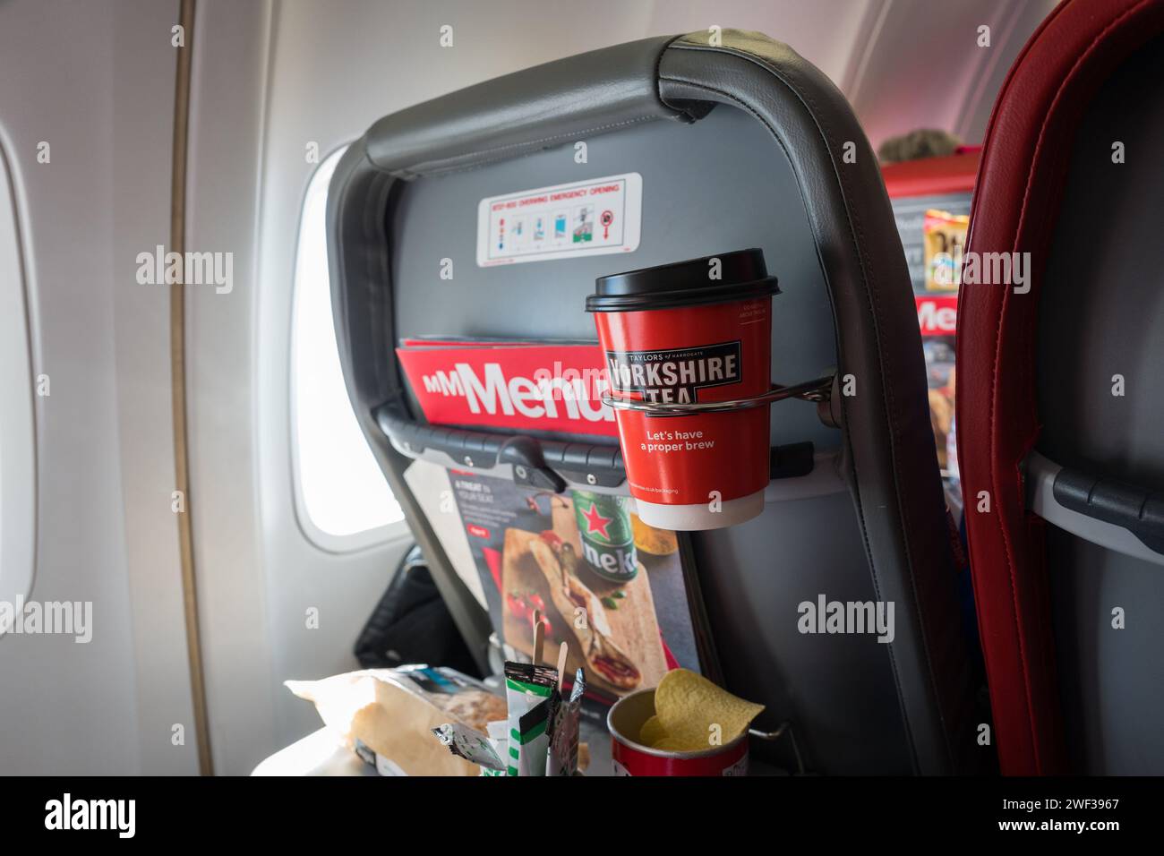 Carboard cup of Yorkshire tea in a metal cup holder on a Jet2 flight ...