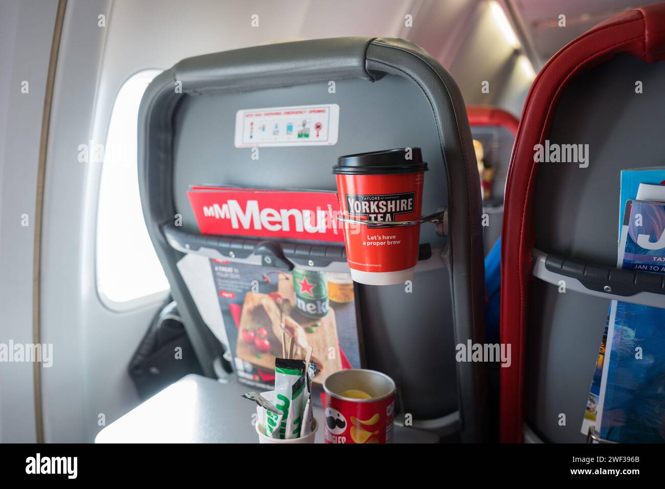 Carboard cup of Yorkshire tea in a metal cup holder on a Jet2 flight ...