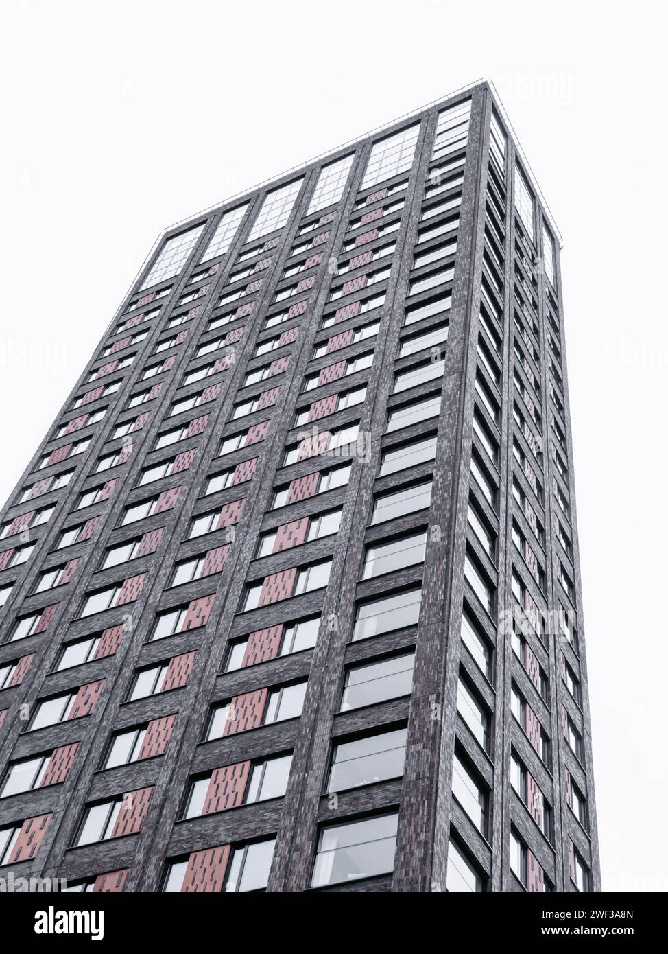The image showcases the towering facade of a contemporary high-rise ...