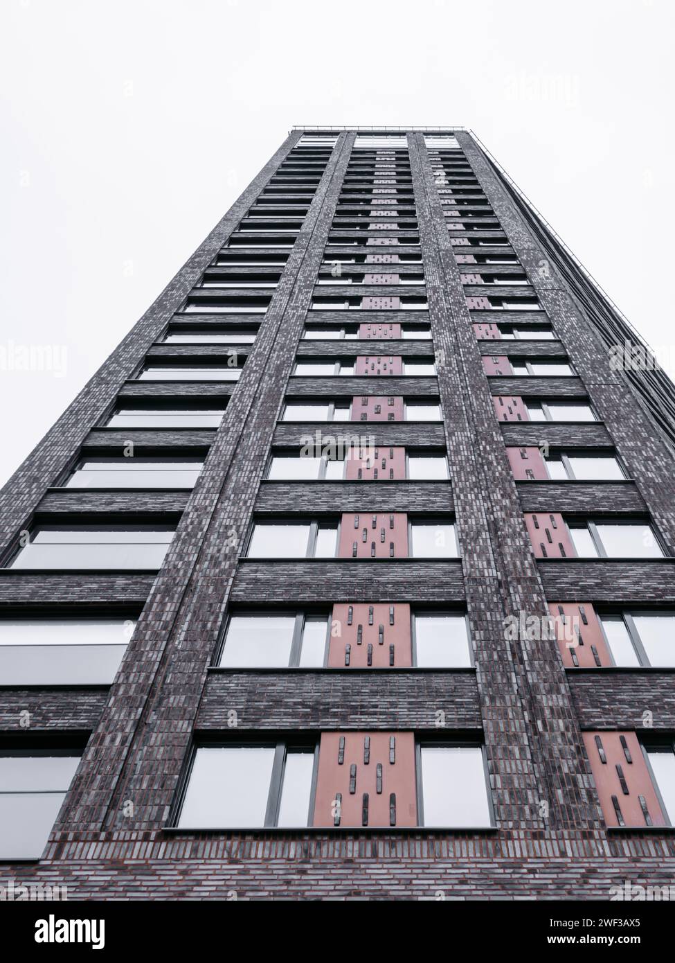 The image showcases the towering facade of a contemporary high-rise ...
