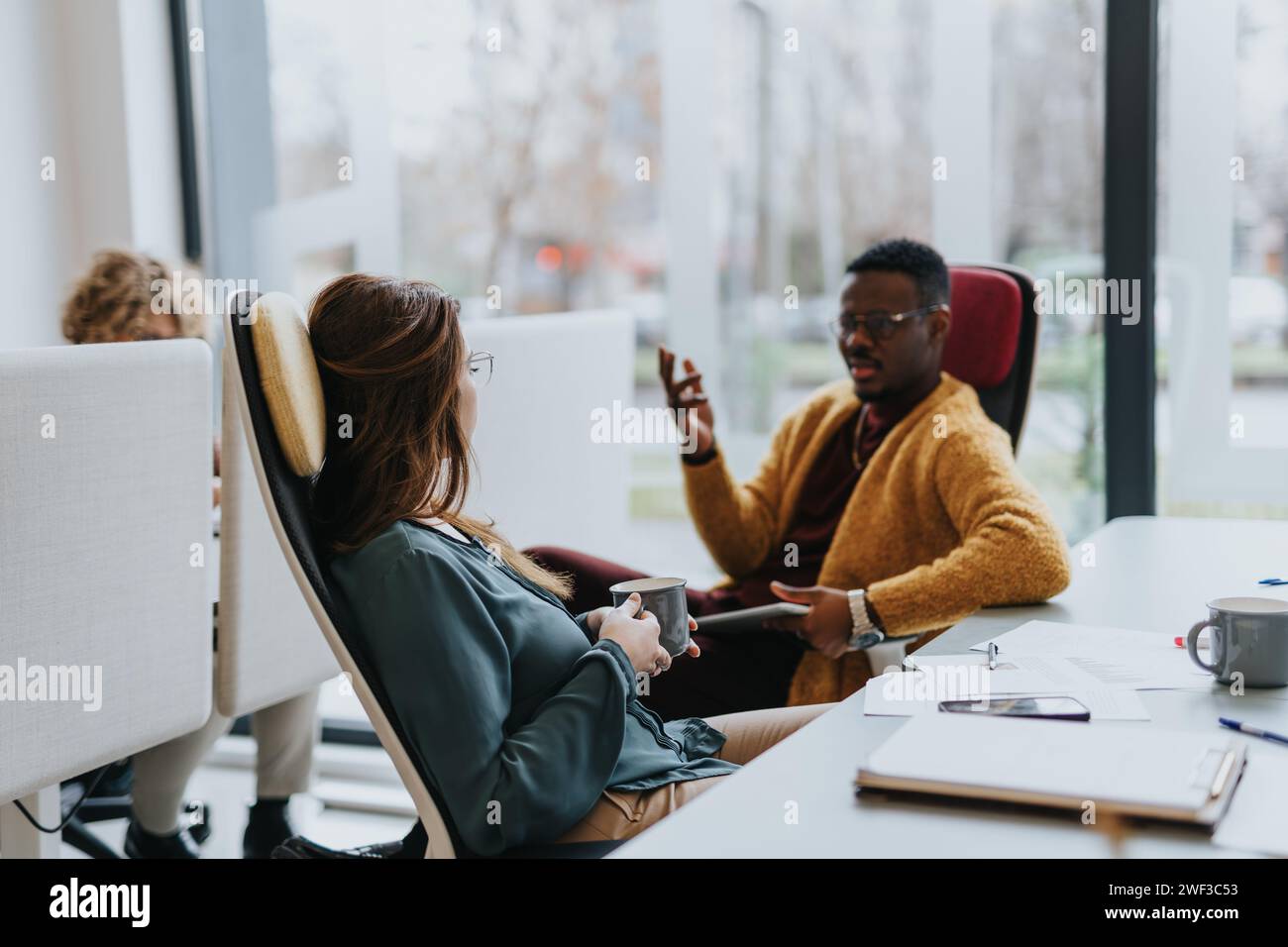 Multiracial team of employees collaborating on a successful business ...