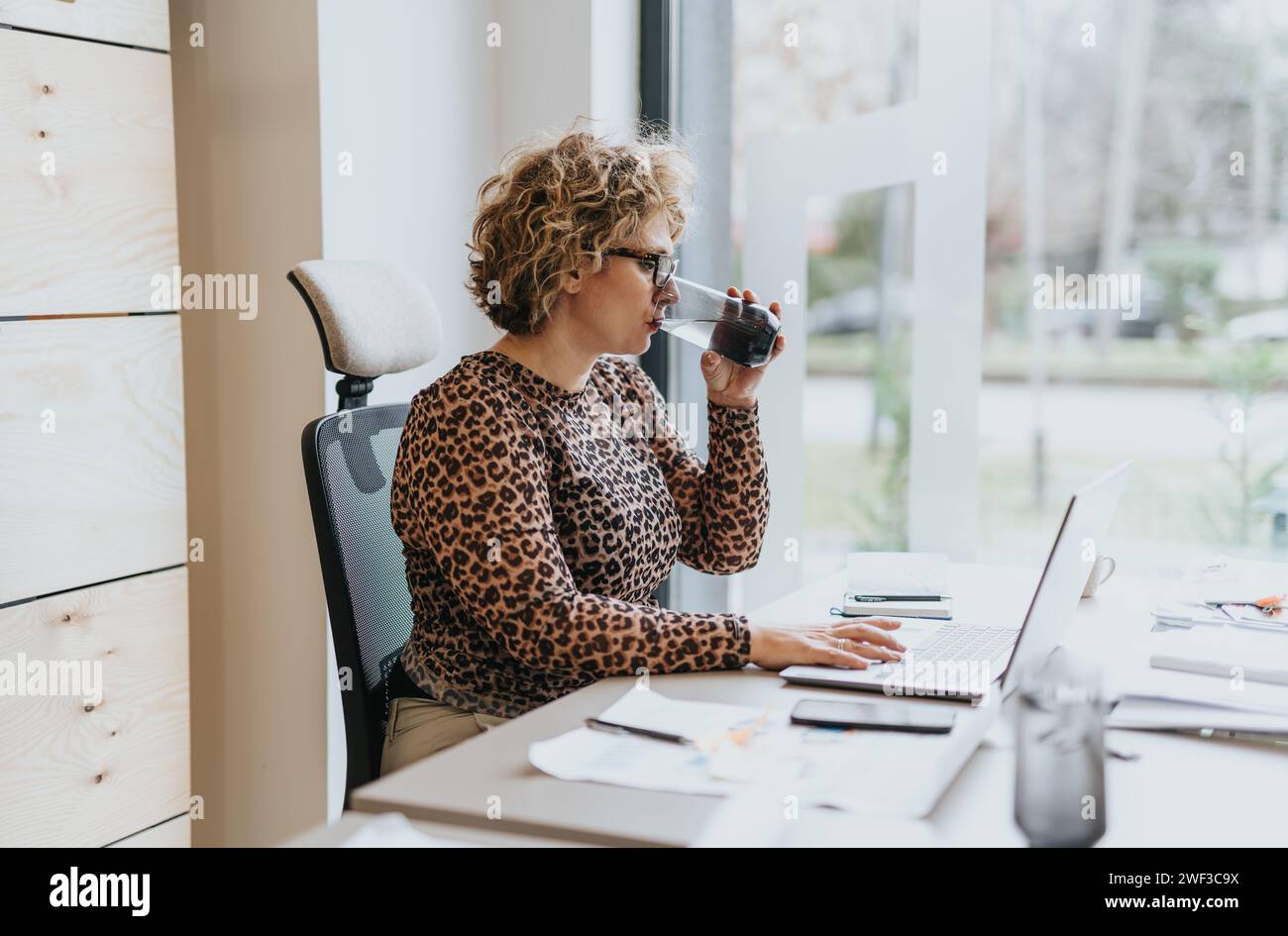 In the midst of a challenging work shift, a senior female employee ...