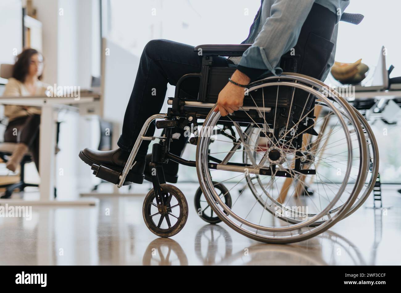 Man in wheelchair collaborating hi-res stock photography and images - Alamy
