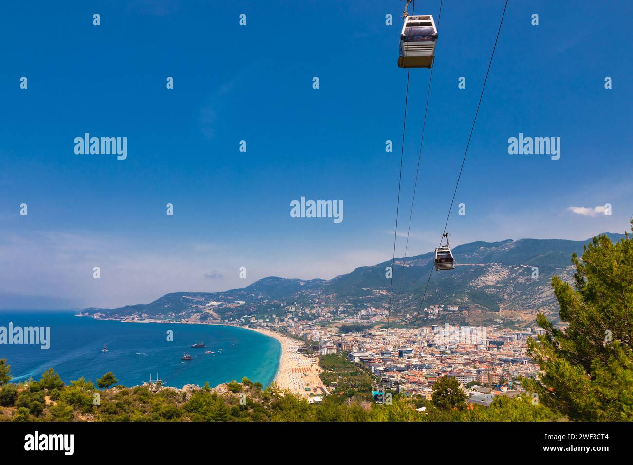 Alanya Teleferik (Cable Car) cabins ascending above the city, offering ...