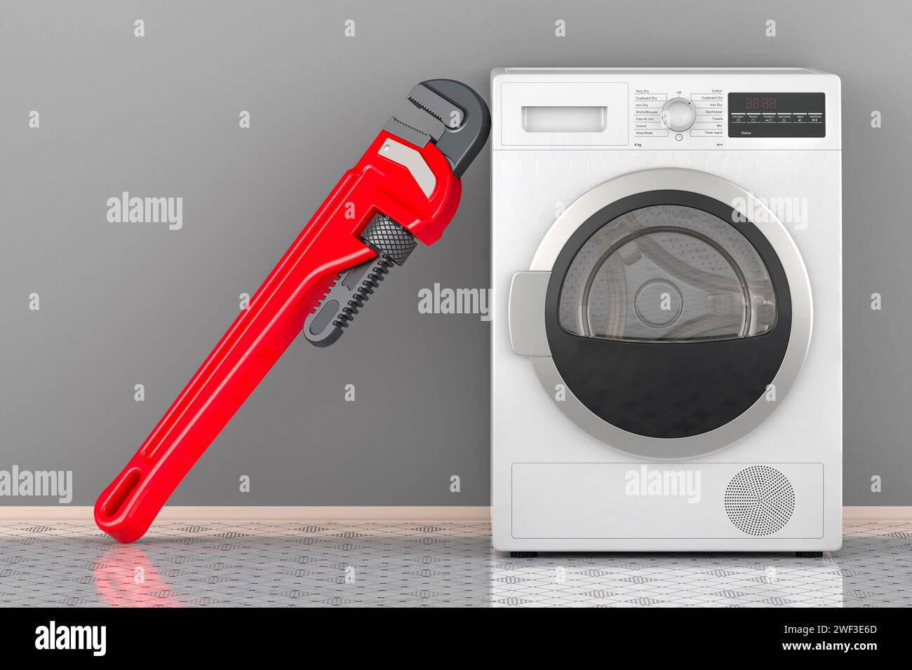 Clothes dryer with pipe wrench in interior. Repair and service of ...