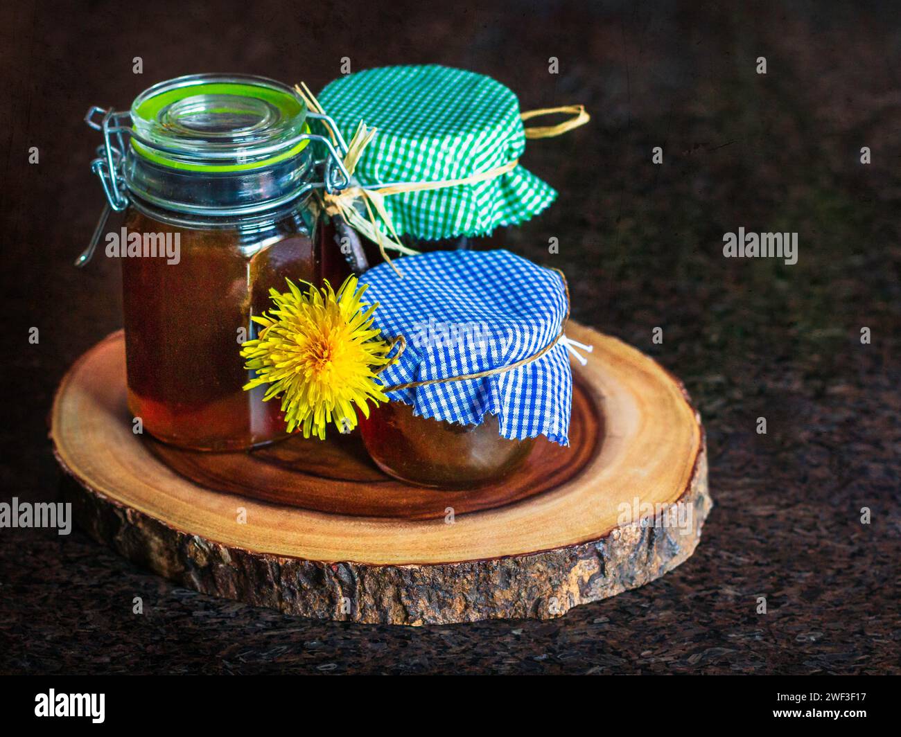 Homemade dandelion honey in jars . Homemade remedy. It is an ...