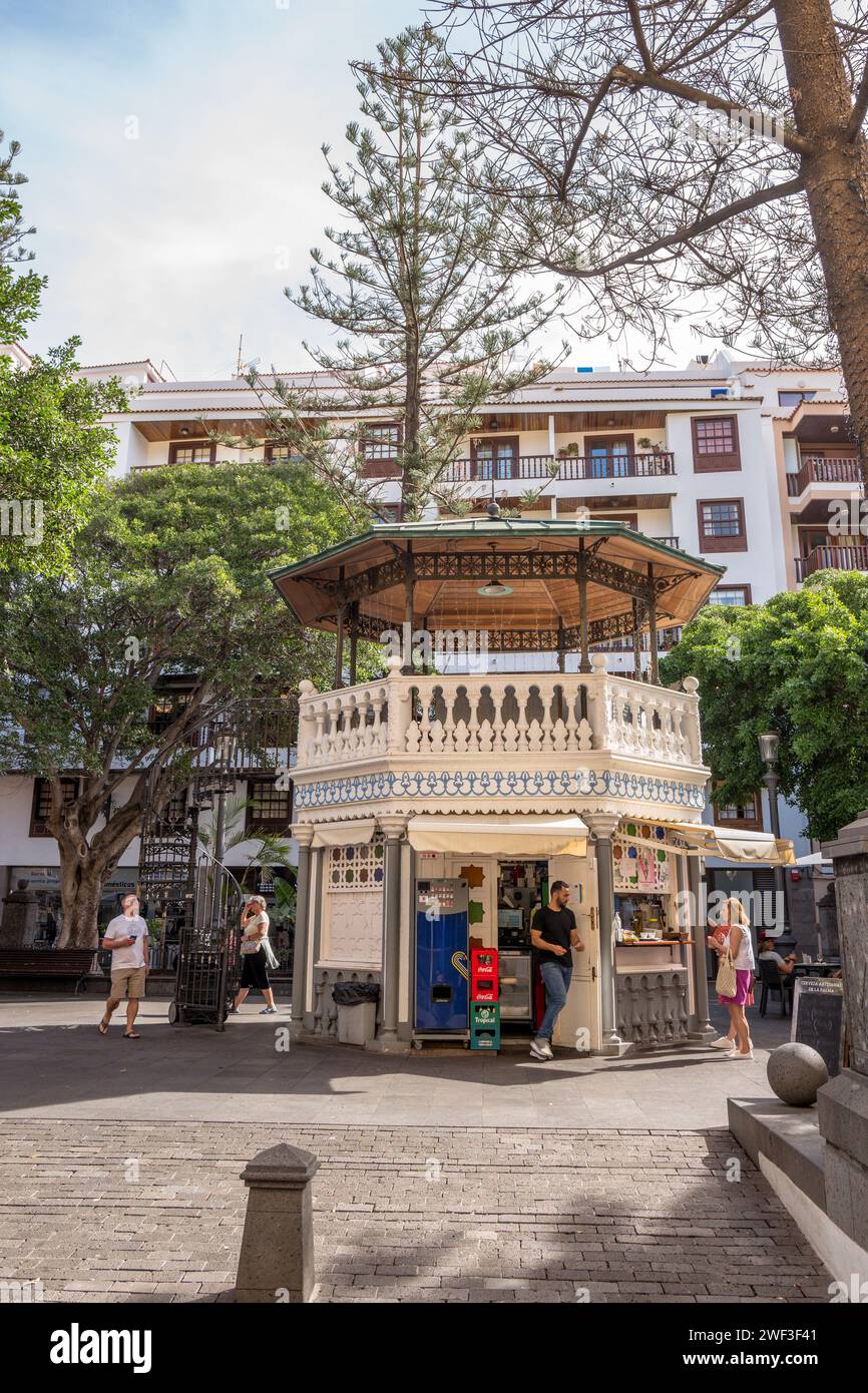 Tourist and locals at the ornate cafe, Kiosca Alameda tree lined Plaza ...