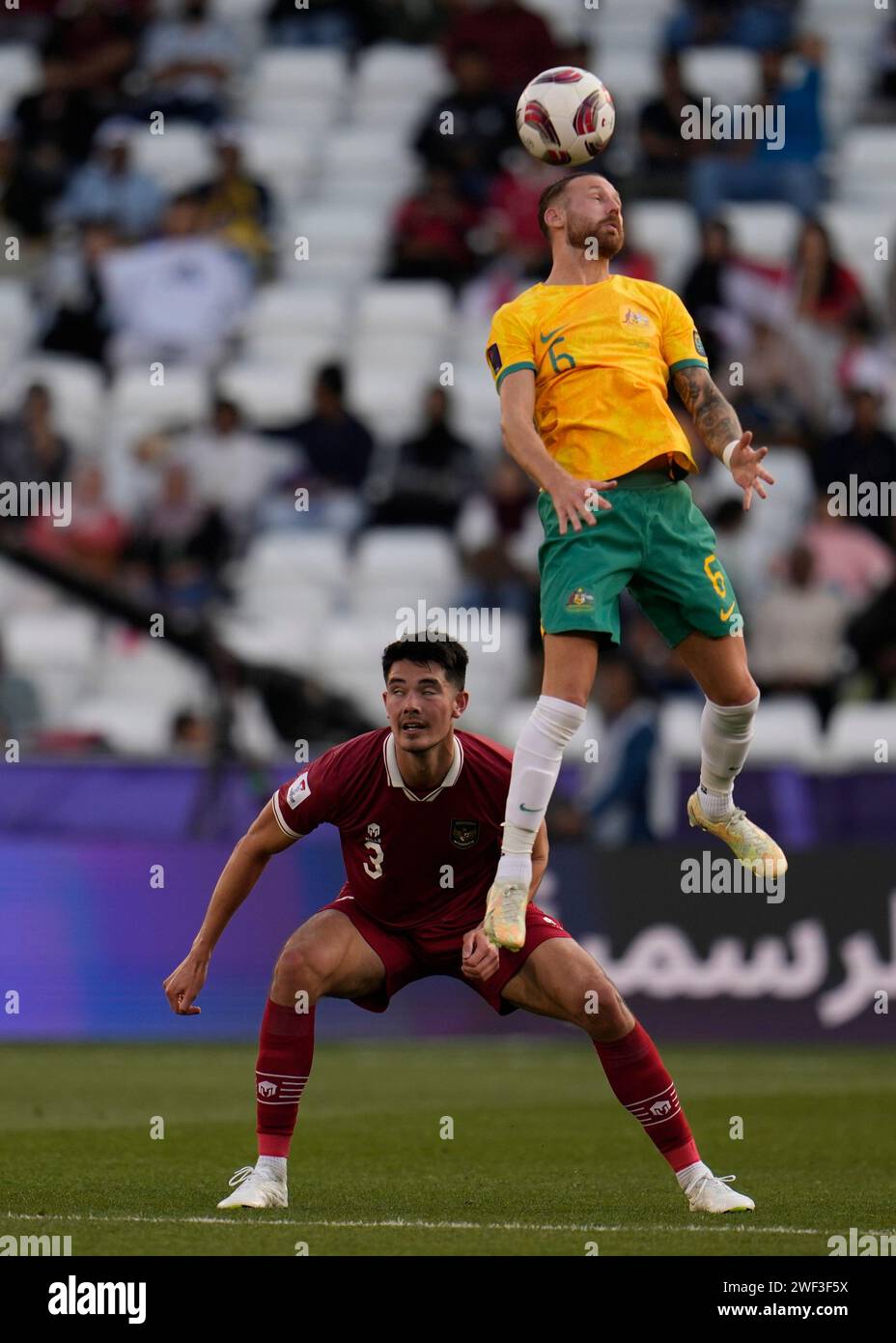 Australia's Martin Boyle heads past Indonesia's Elkan Baggott during ...