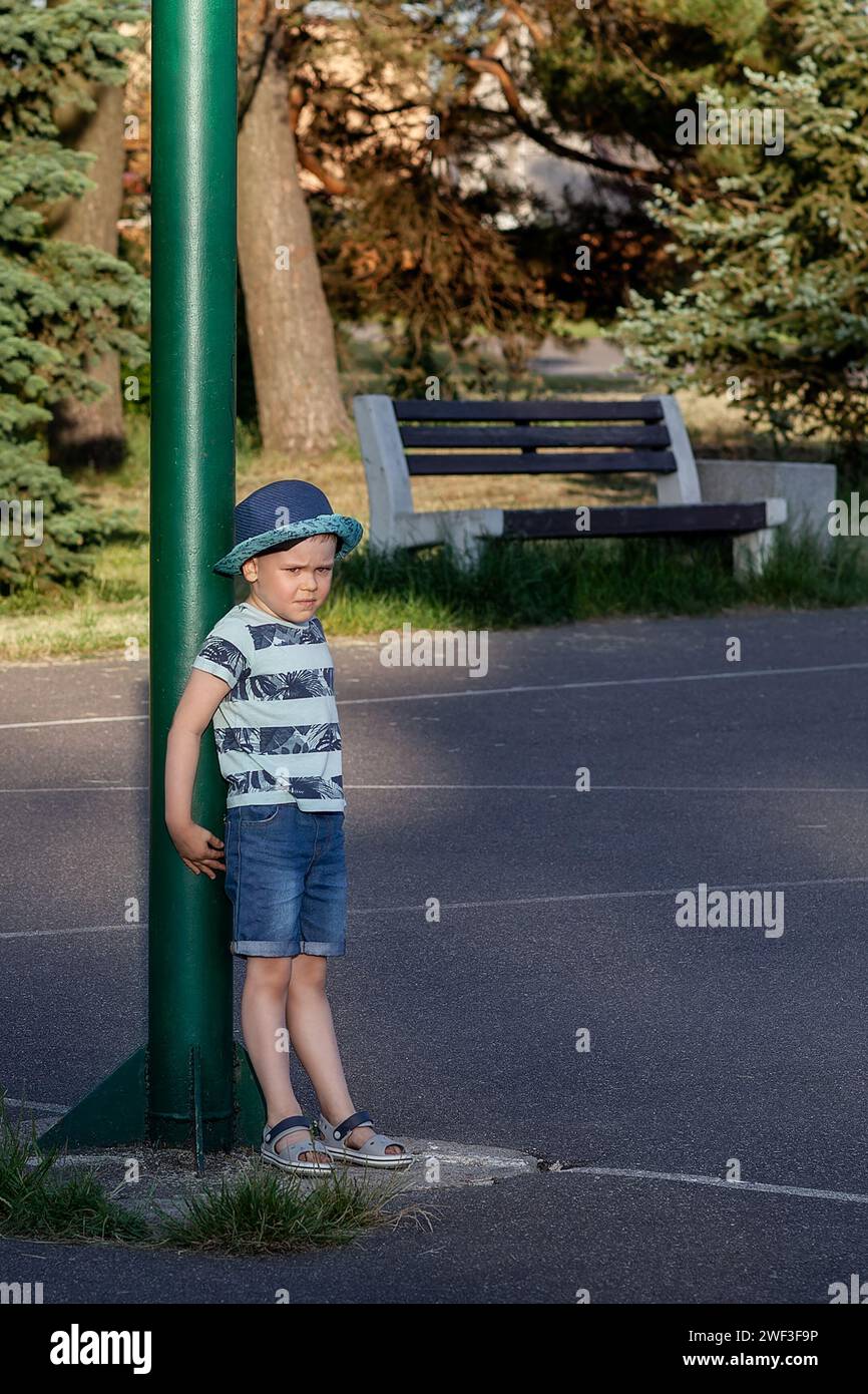 Child standing alone in playground hi-res stock photography and images ...
