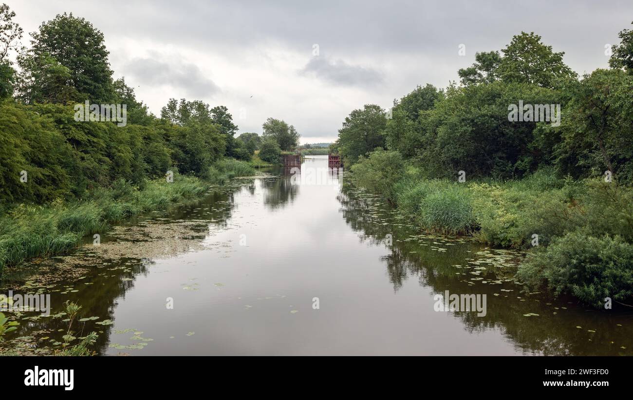 The landscape of the Lithuanian canal, in the distance you can see the ...