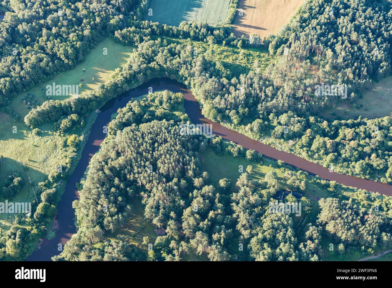 A bend of the river between Lithuanian forests, photographed while ...