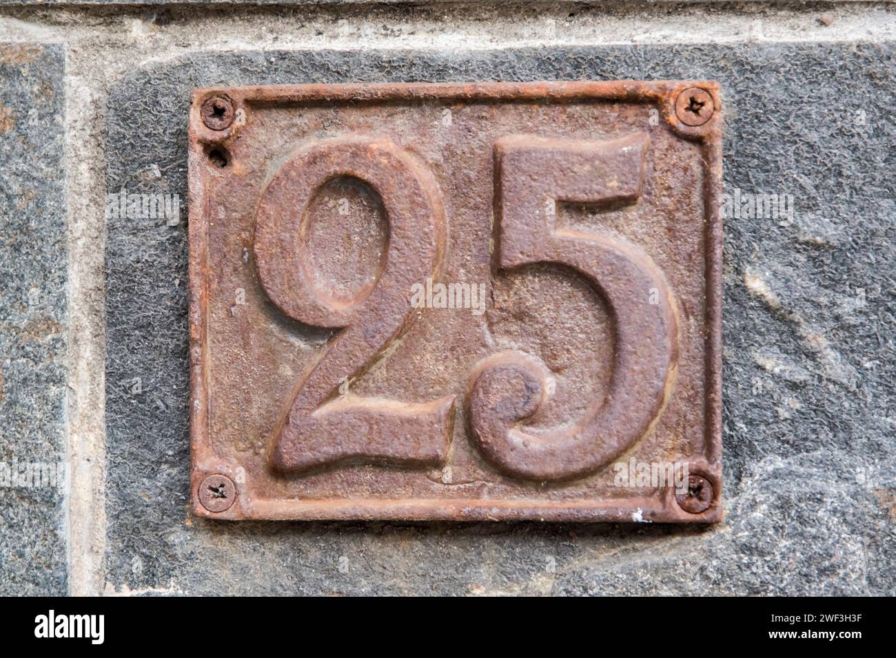 Old retro weathered cast iron plate with number 25 Stock Photo - Alamy