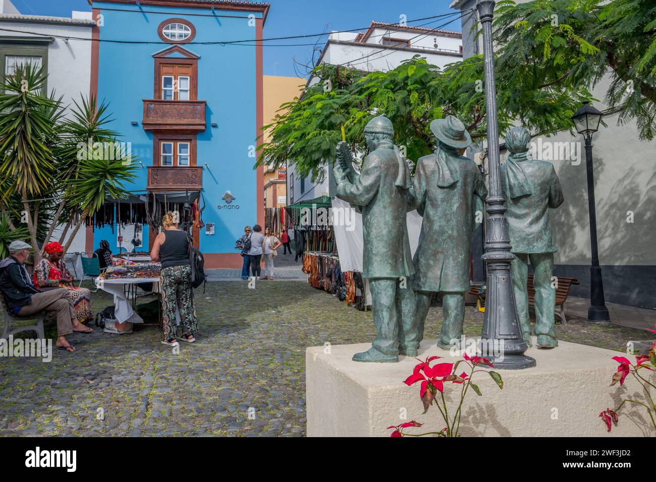 A Bronze statue of three male singers at the Plaza de Vandale, Santa ...