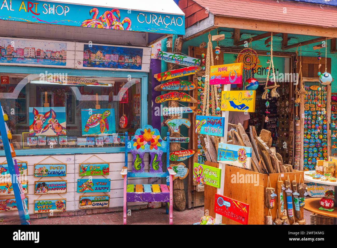 Colorful souvenir shops lining Willemstad's central street in Curacao ...