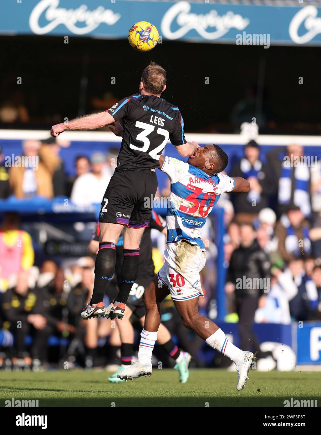 Huddersfield Town's Tom Lees (left) and Queens Park Rangers' Sinclair ...