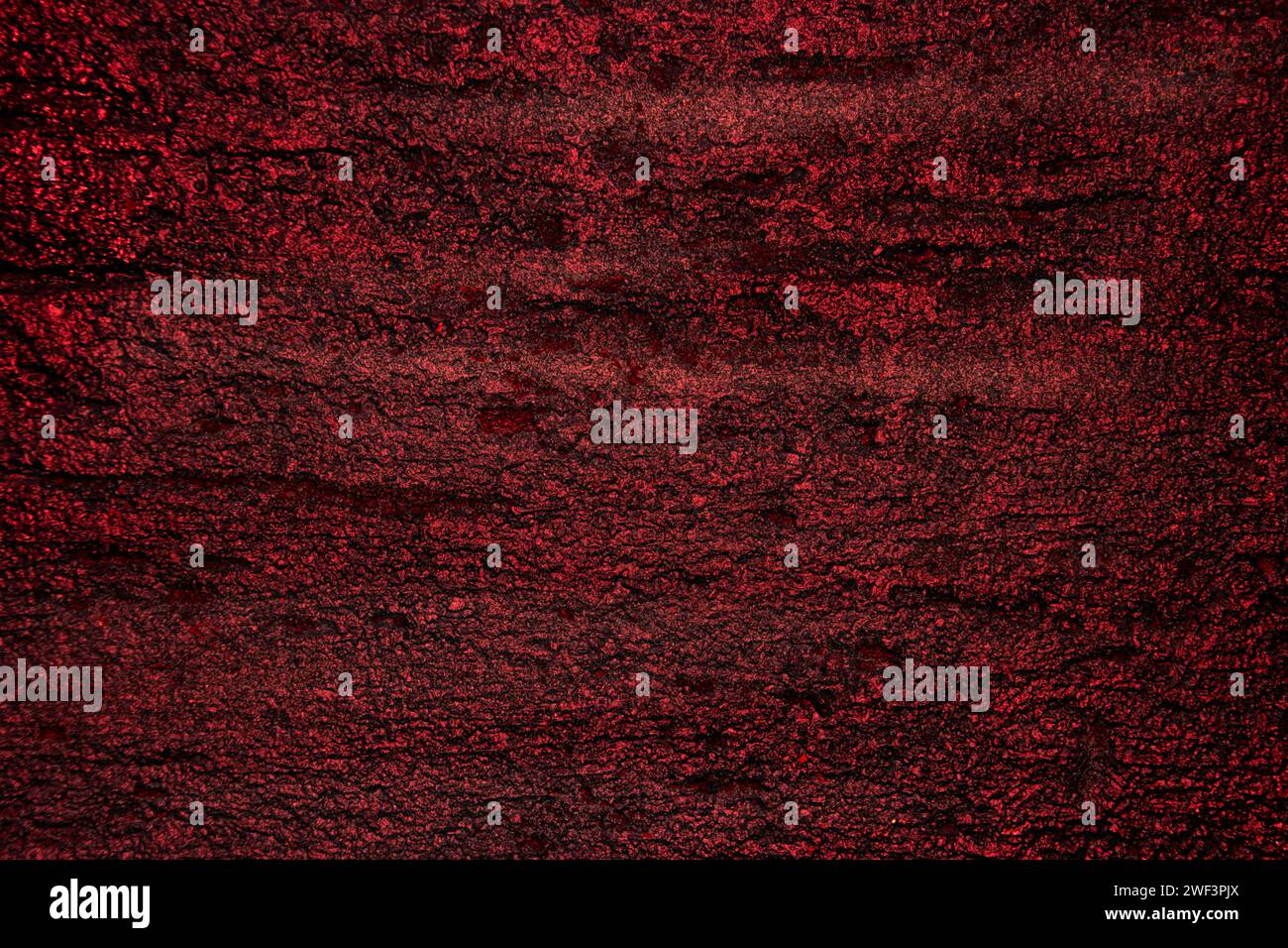 Crimson red colored abstract wall background with textures of different ...