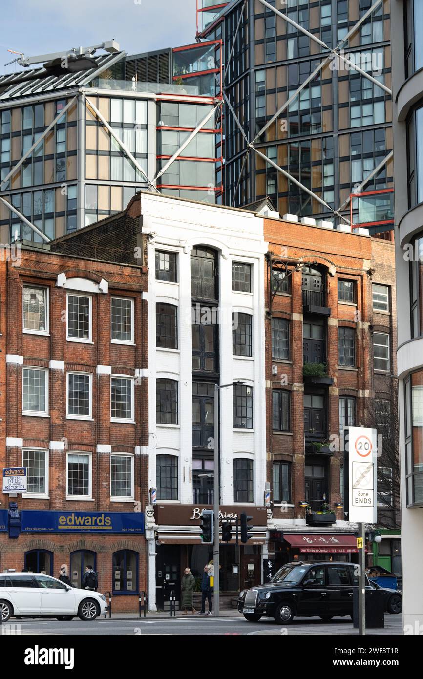 A contrast of old and new architecture in London, with a historic brick ...