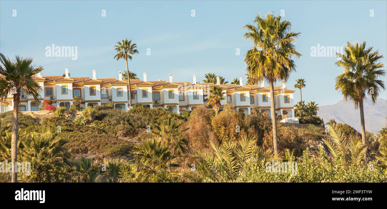 Row of spanish houses on a hill top which are all the same and are ...