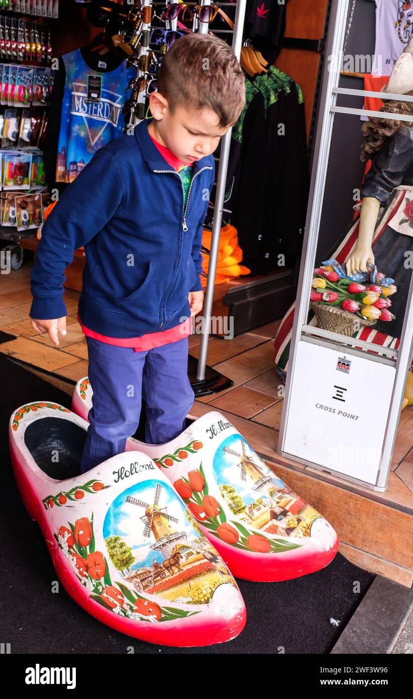 Netherlands, Little boy posing in typical huge Dutch wooden clogs Stock ...
