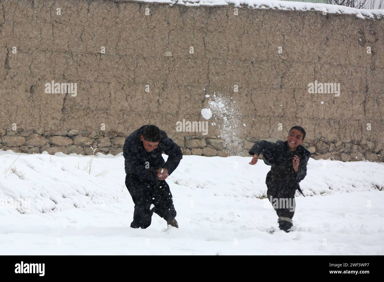 Kabul, Afghanistan. 28th Jan, 2024. Children play with snow in the ...