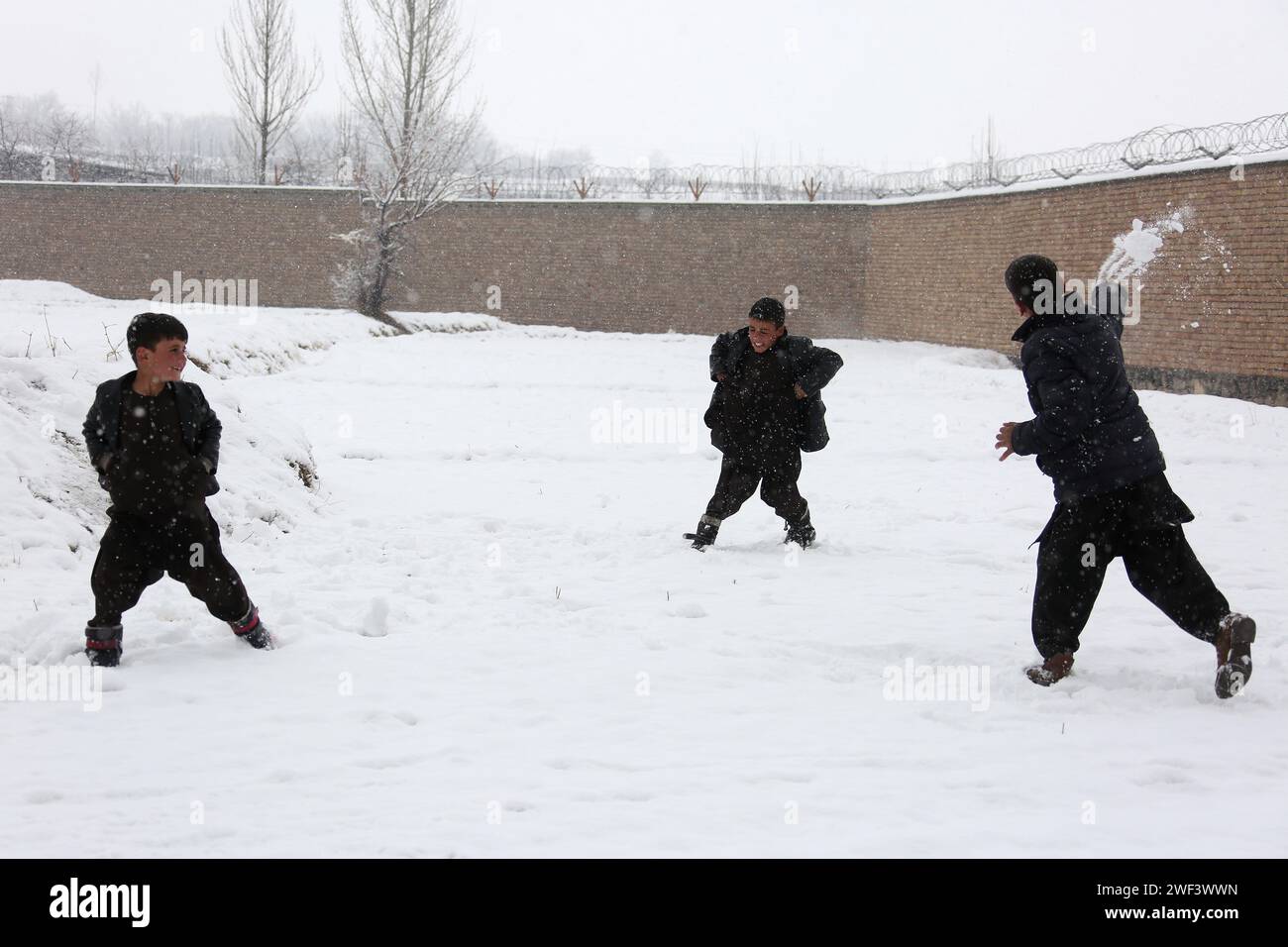 Kabul, Afghanistan. 28th Jan, 2024. Children play with snow in the ...