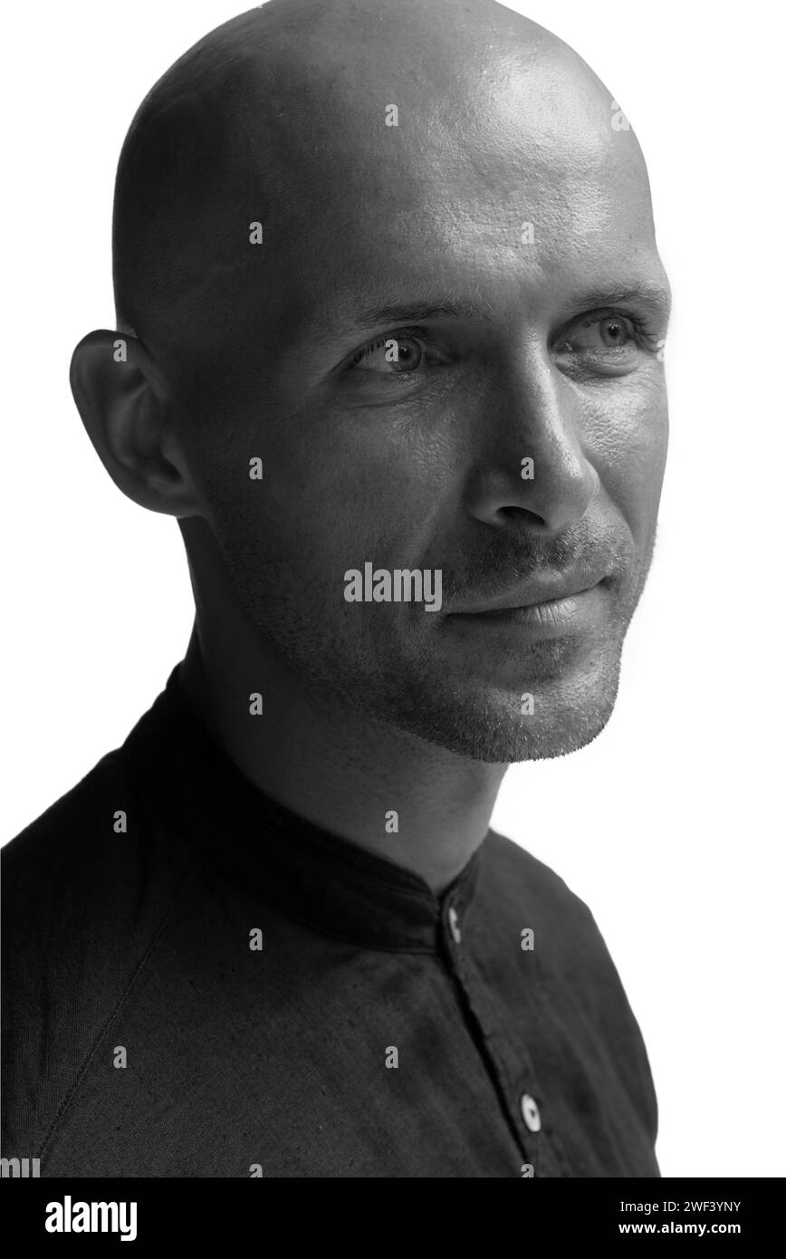 A high-contrast monochrome photo portrait of a man looking sideways ...