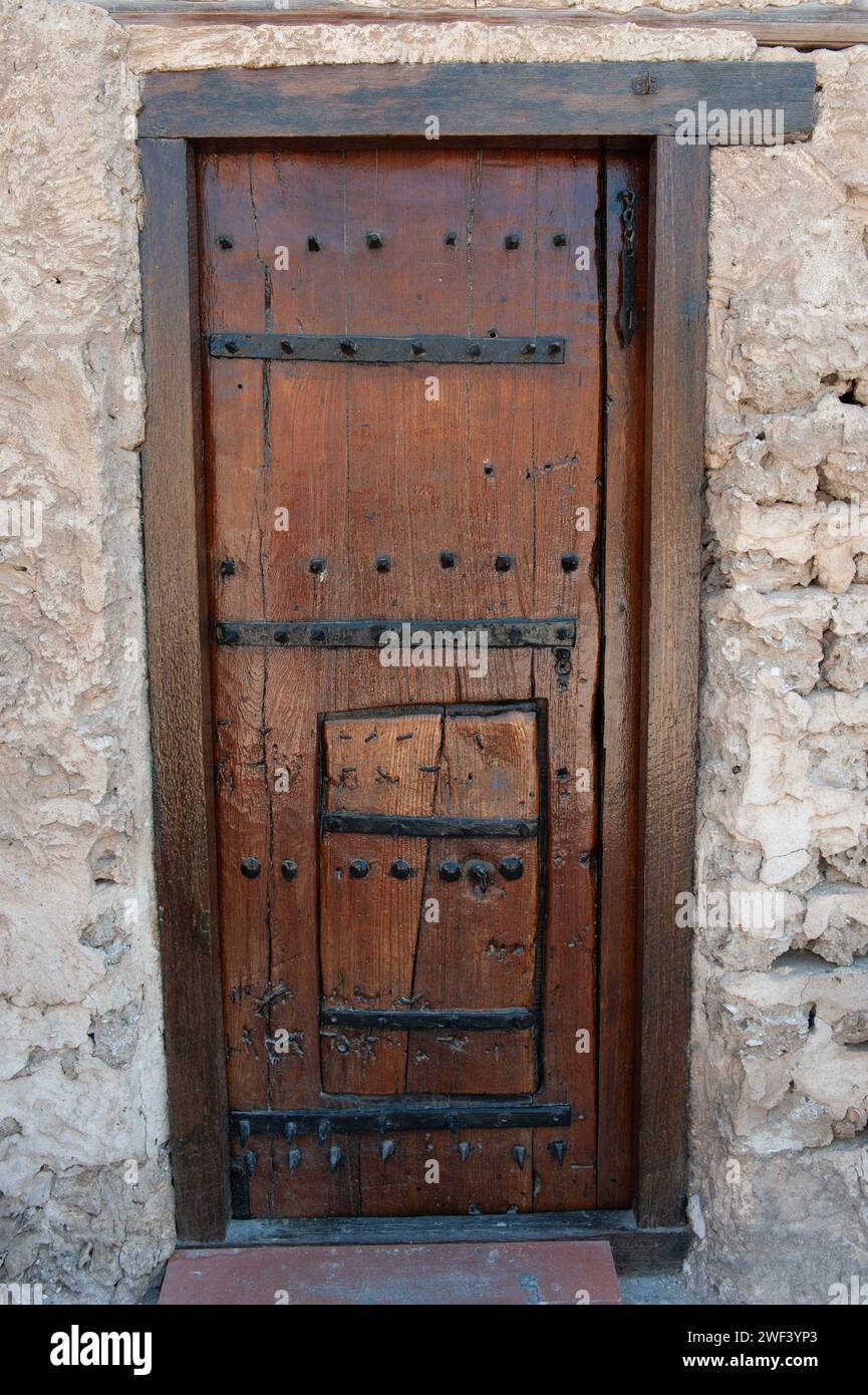 Decorative wooden door at the Dubai Heritage Village tourist attraction ...