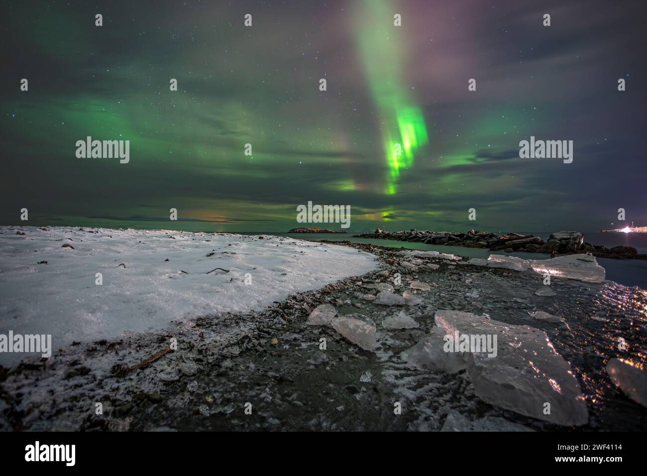 The Northern Lights grace the skies over Iceland on a freezing winters ...