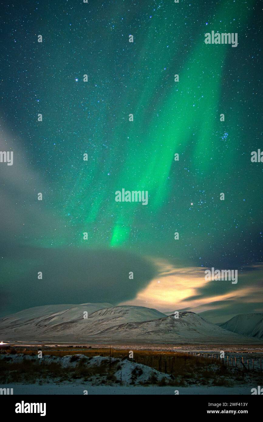 The Northern Lights grace the skies over Iceland on a freezing winters ...