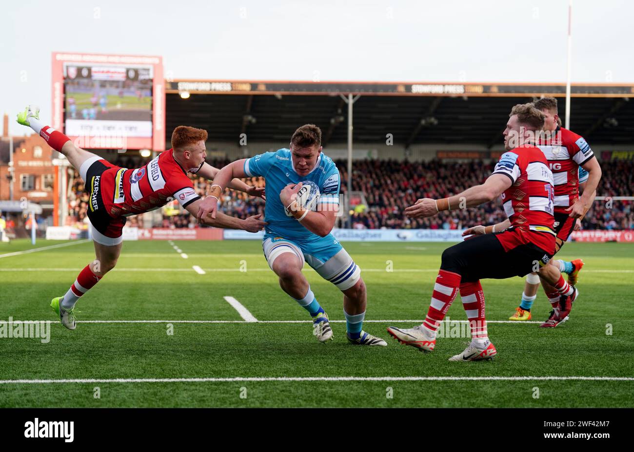 Sale Sharks' Cobus Wiese (centre) runs between Gloucester's Caolan ...