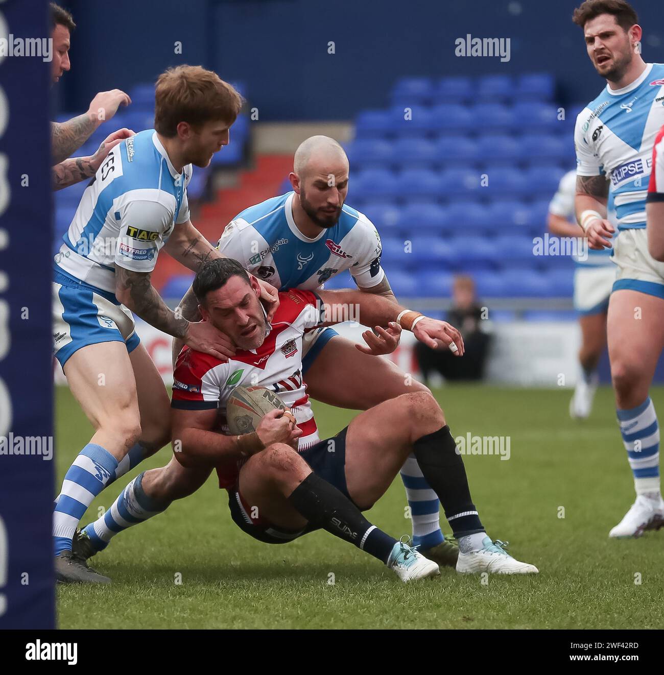 Oldham, UK. 28th Jan, 2024. Joe Keyes and Ben Crooks make a tackle for ...