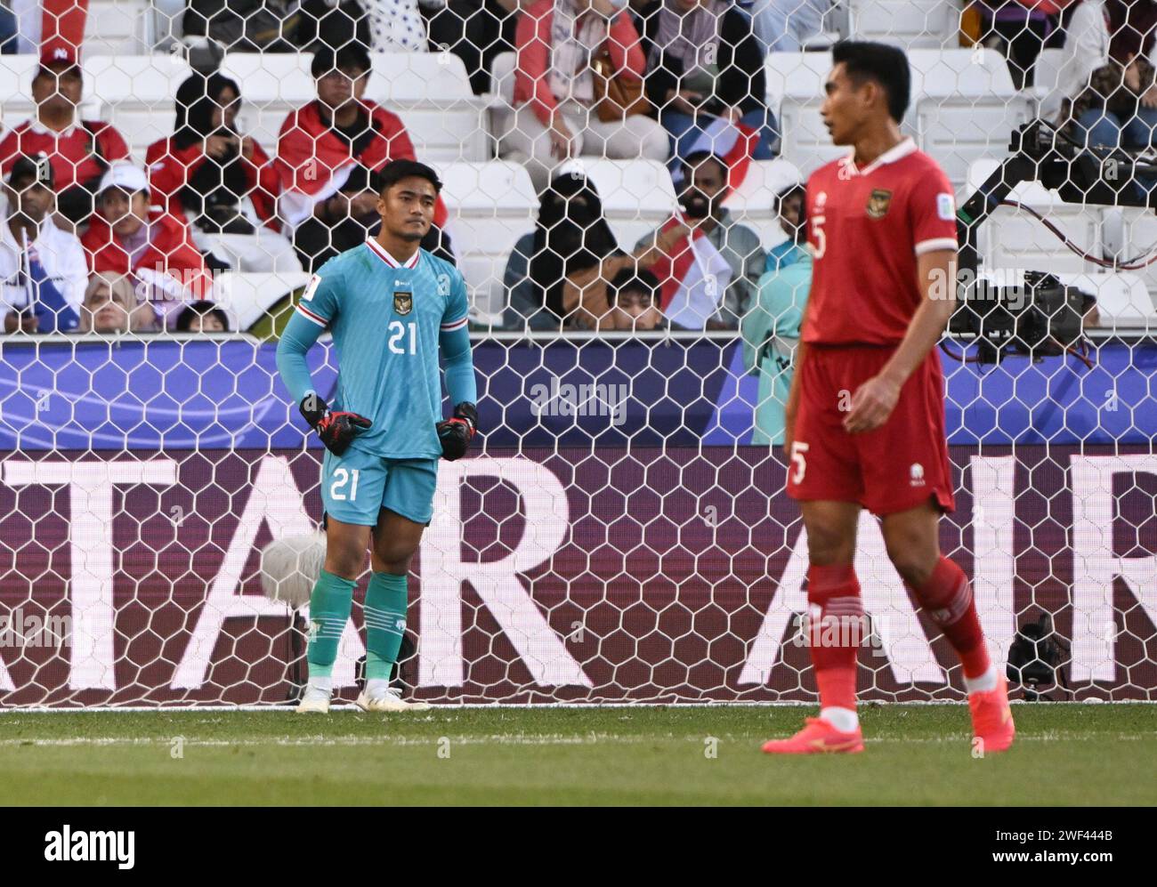 Doha, Qatar. 28th Jan, 2024. Ernando Ari Sutaryadi (L), goalkeeper of ...