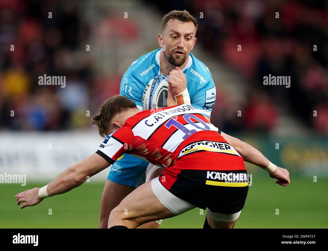 Sale Sharks' Sam Bedlow (left) is tackled by Gloucester's Charlie ...