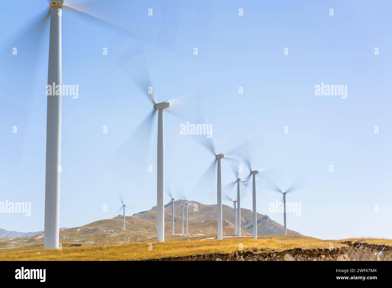 Windmills converting wind energy into electricity Stock Photo - Alamy