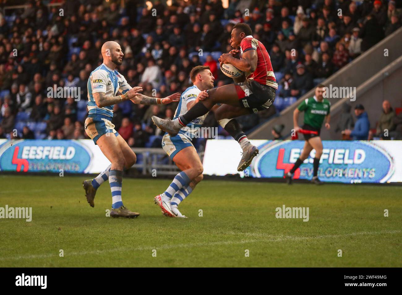 Oldham, UK. 28th Jan, 2024. Greg Eden tackles Mo Agoro*** during the ...
