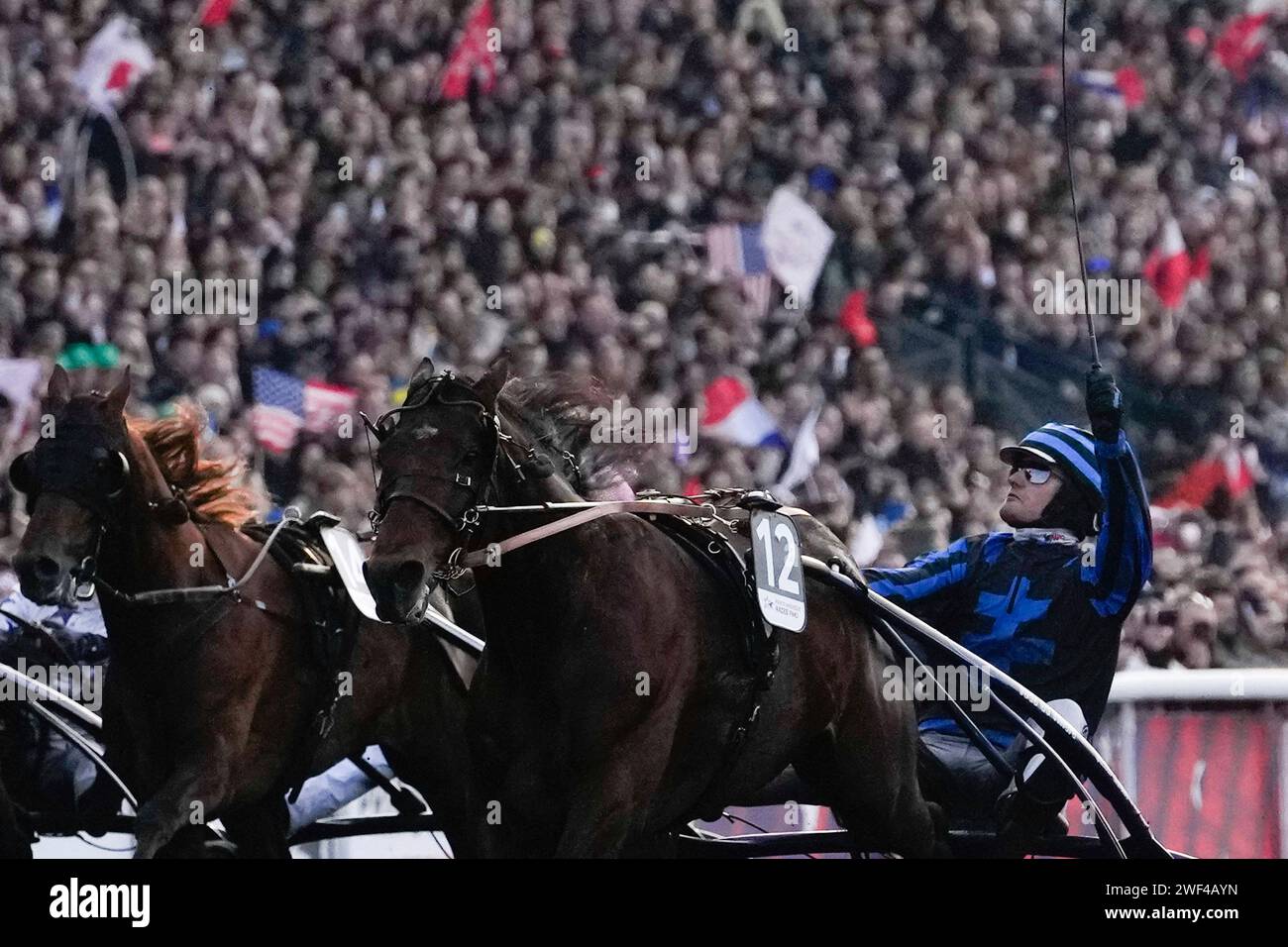 French jockey Clement Duvaldestin driving Idao de Tillard, right ...