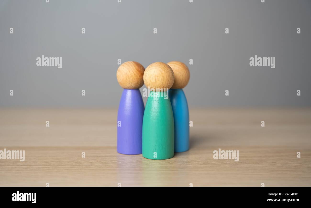 Three human figures. Team or group. Assistance, cooperation and ...