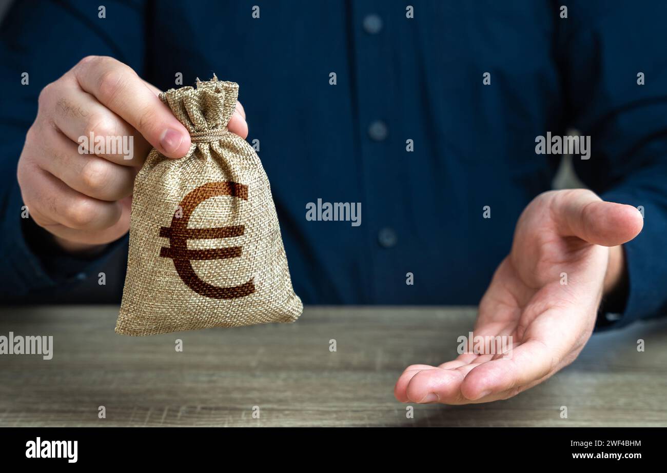 Giving gesture and euro money bag. Banking and crediting. The man ...