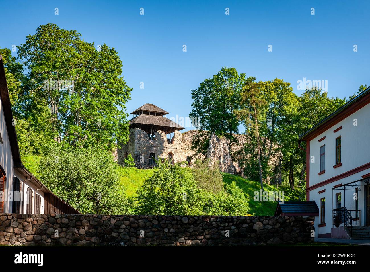 Medieval Castle Ruins in Latvia Rauna. The ruins of a castle on a hill ...