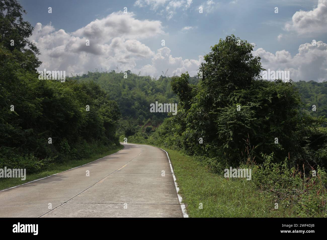 Concrete road during daytime with blue sky view in the background and ...