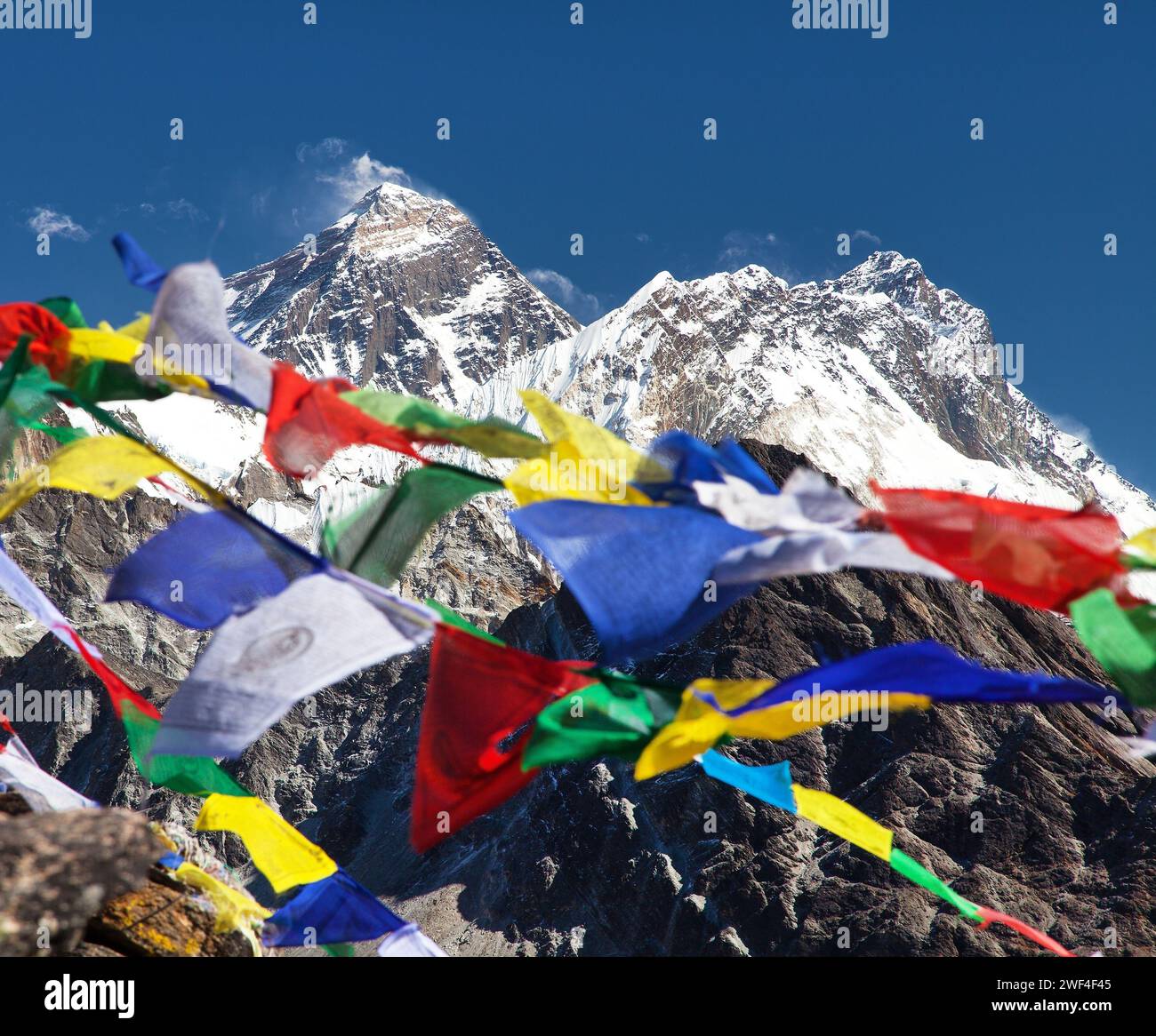 view of Mount Everest and Lhotse with buddhist prayer flags from Gokyo ...