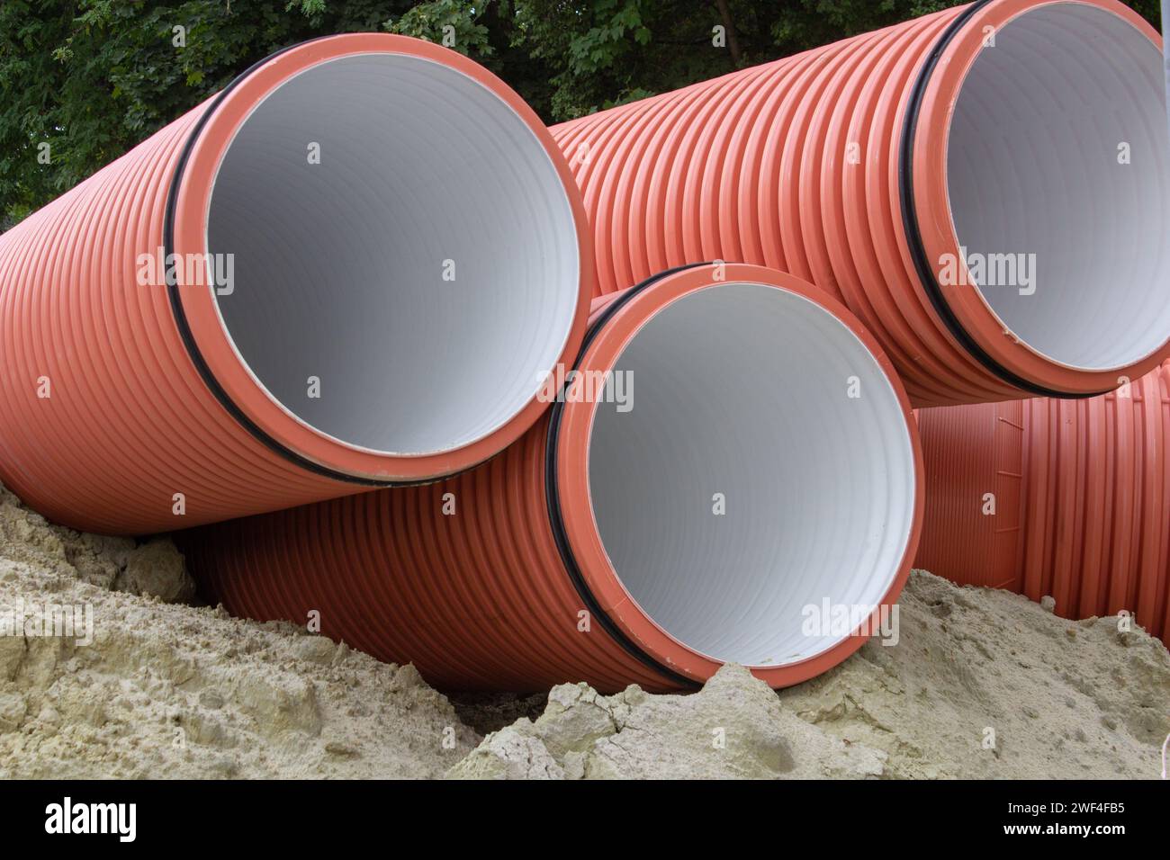 large plastic corrugated pipes on the road Stock Photo - Alamy