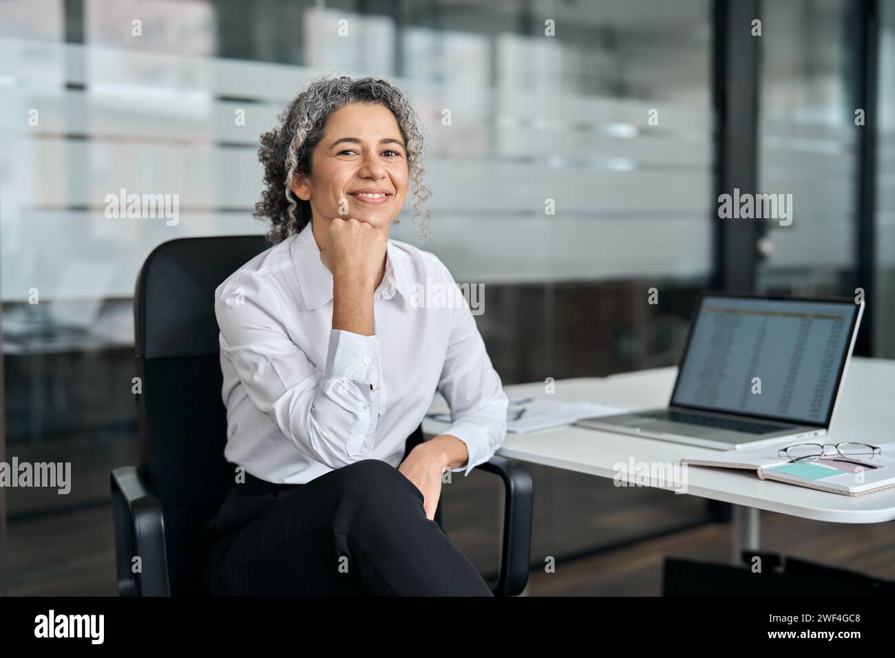 Female senior manager sitting in office hi-res stock photography and ...