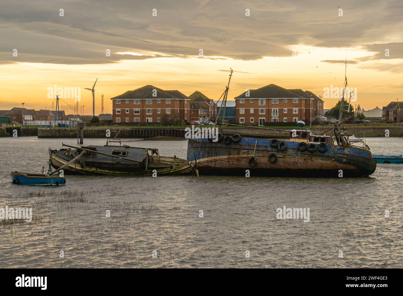 Derelict half sunken trawler boats in Fleetwood harbour, UK Stock Photo ...
