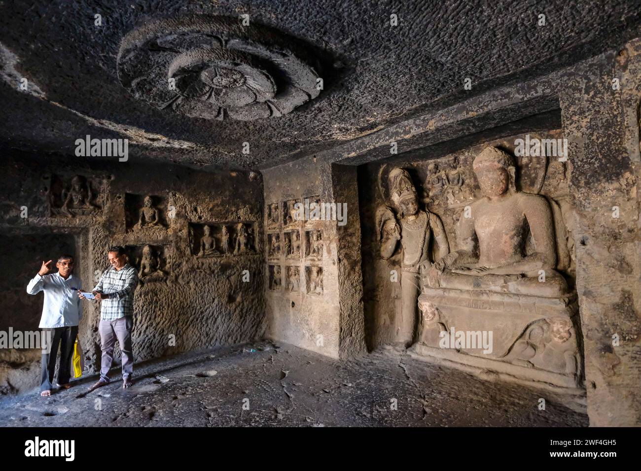 Ellora, India - January 22, 2024: Two men visiting the Ellora Caves ...